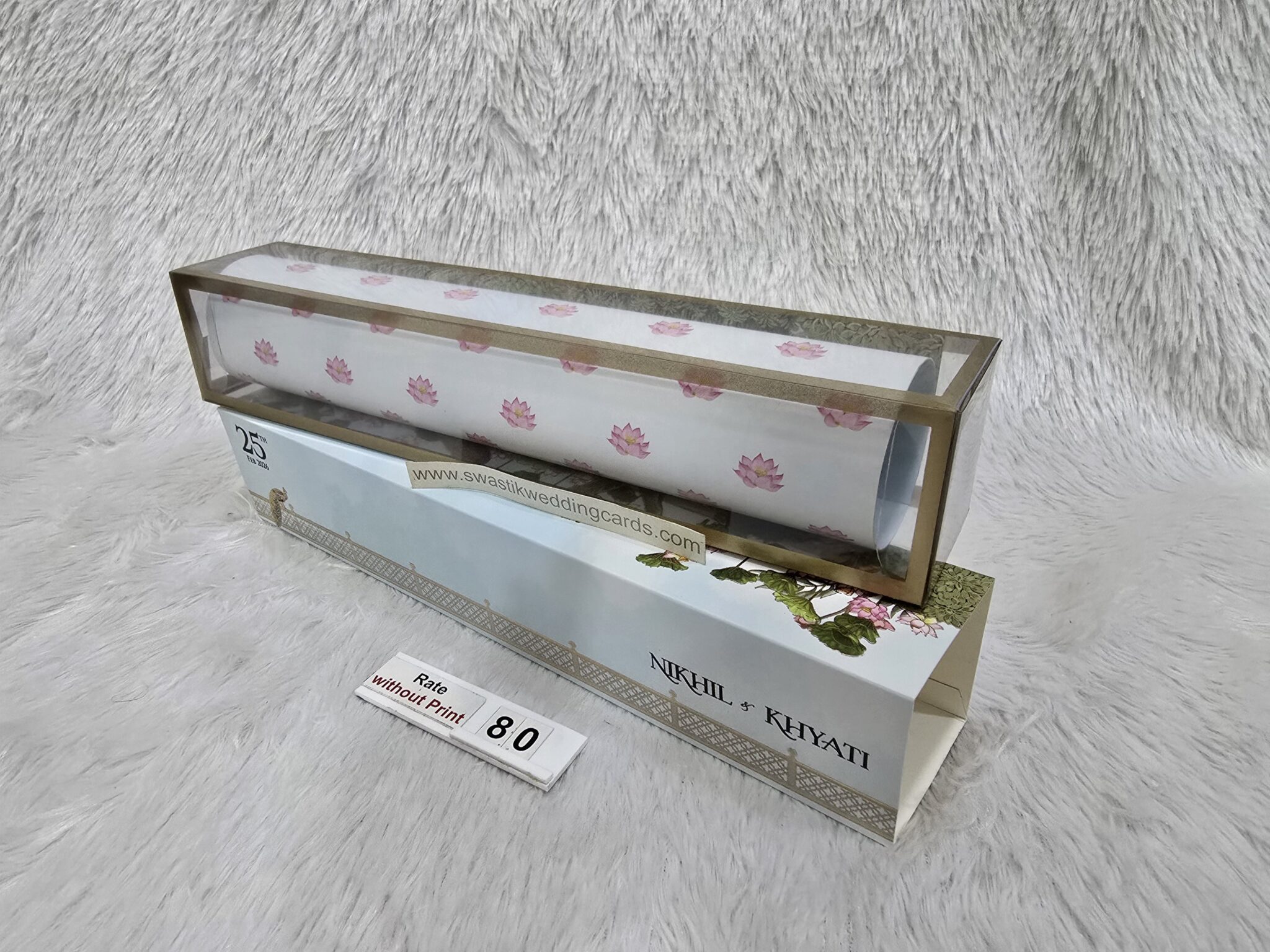 Plastic cube box with slider cover and paper scroll with design and ...