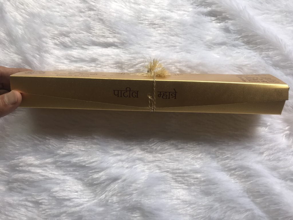 Golden scroll box with thread and scroll – Swastik Cards