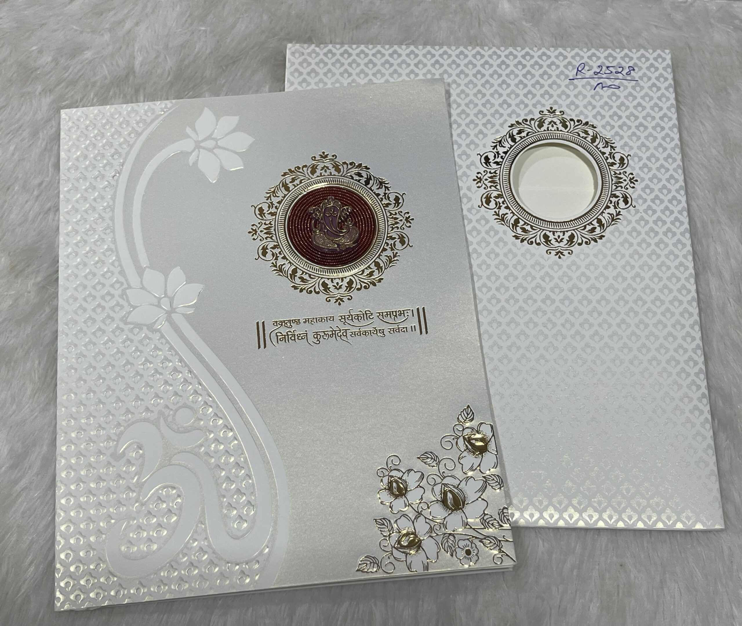 Folder style wedding invitation card with ganesh and shlok along with ...