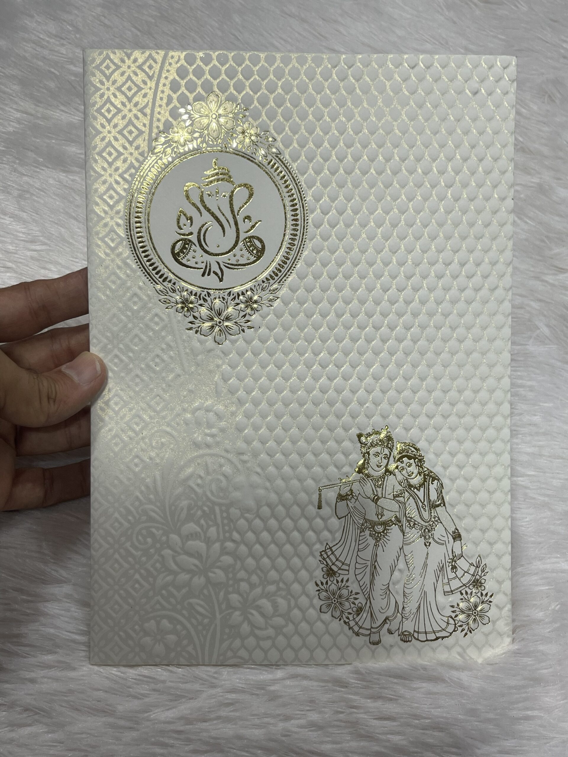 Folder style wedding invitation card with Ganesh and radhakrishna along ...